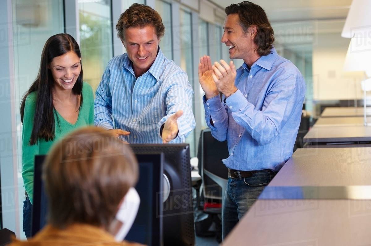 Business team closing a deal, happy - Stock Photo - Dissolve