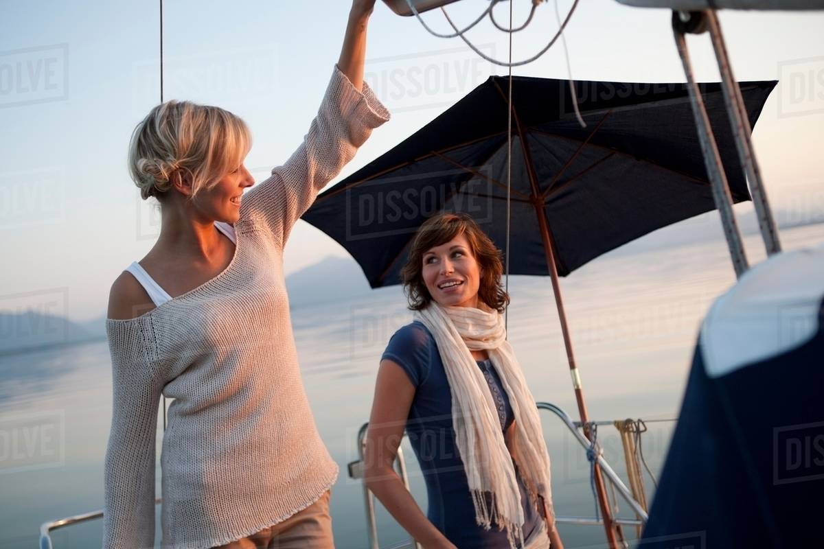 Girls standing on boat - Royalty-free Stock Photo | Dissolve