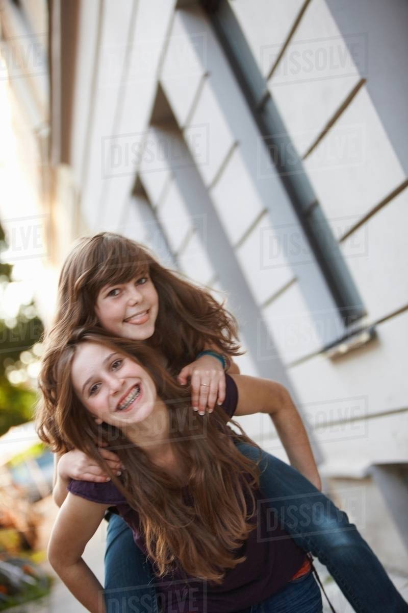 2 girls having fun together - Stock Photo - Dissolve