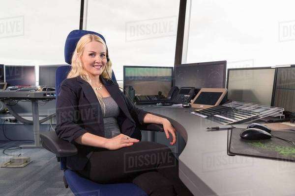 Portrait of female air traffic control tower worker - Stock Photo ...