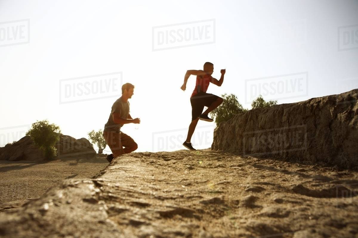Two male friends running together, outdoors - Royalty-free Stock Photo ...