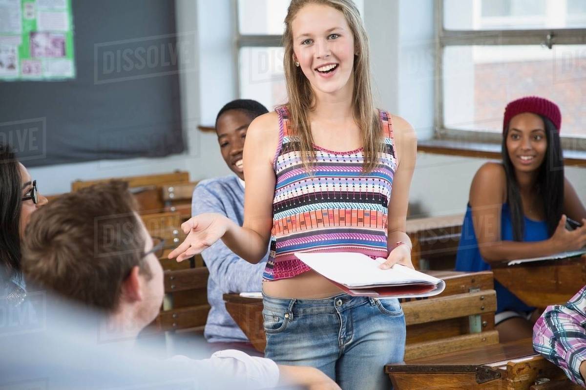 Female student making presentation to class - Royalty-free Stock Photo ...