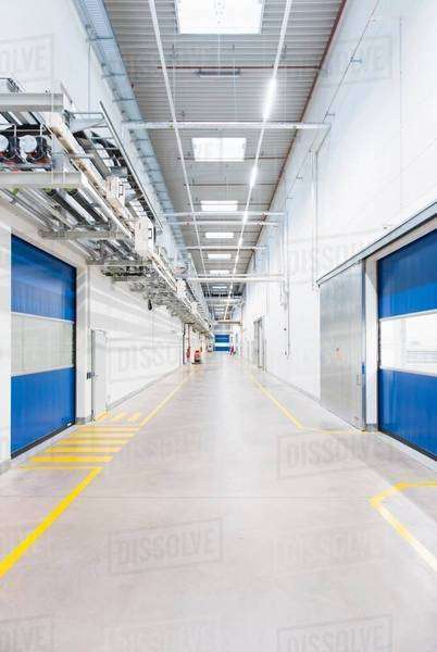 Factory corridor with industrial sliding doors - Stock Photo - Dissolve