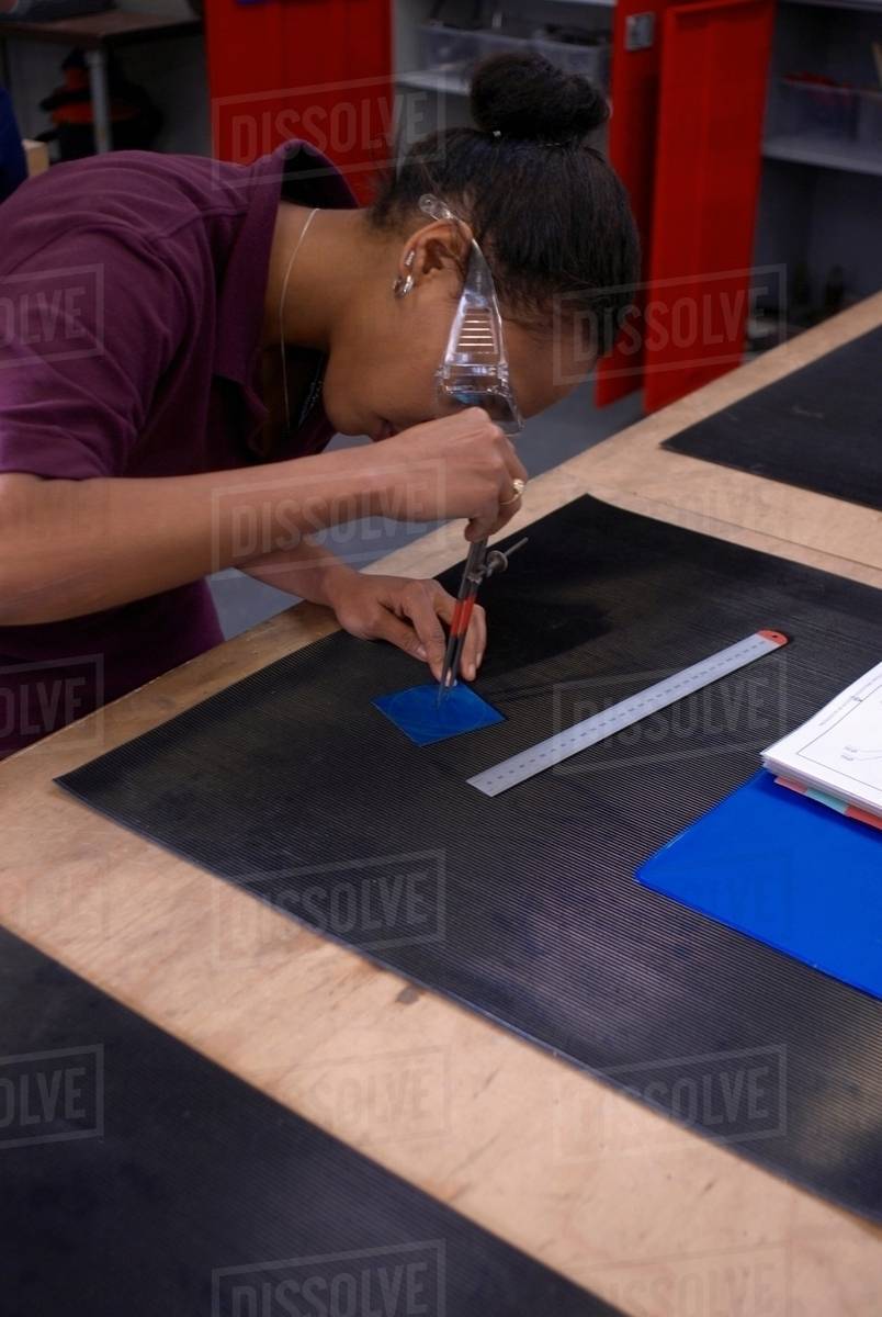 Worker tracing with compass in factory - Royalty-free Stock Photo ...