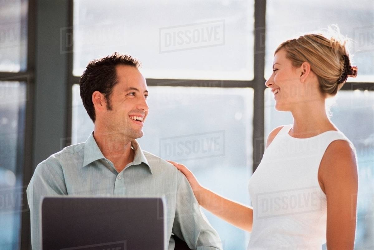 Business people laughing together - Stock Photo - Dissolve