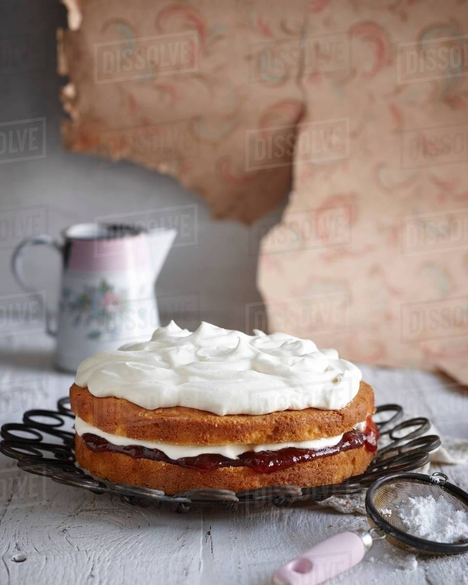 Iced sponge custard cake on vintage dish - Royalty-free Stock Photo ...