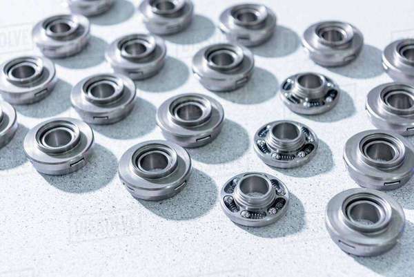 Valve rotators on assembly line in automotive parts factory - Stock ...