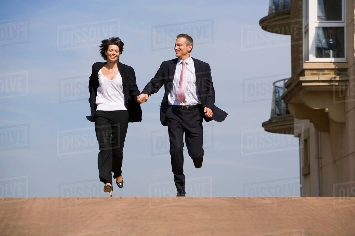 Business people running on street - Royalty-free Stock Photo | Dissolve