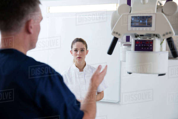 Doctor and nurse using medical x-ray equipment in hospital - Stock ...