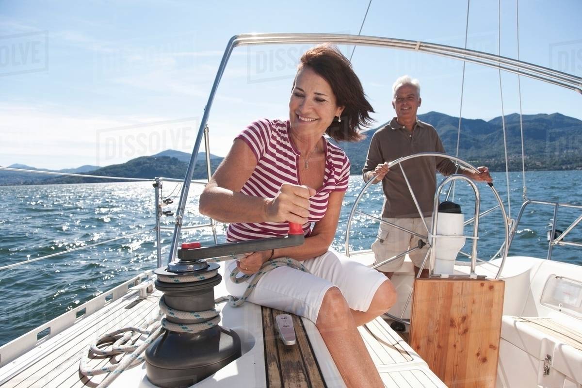 Older couple sailing together - Stock Photo - Dissolve