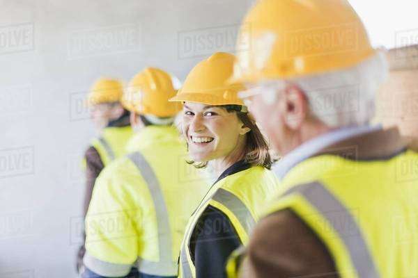 Construction worker smiling on site - Royalty-free Stock Photo | Dissolve
