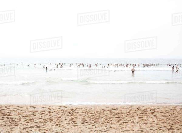 Crowd of people in the sea - Stock Photo - Dissolve