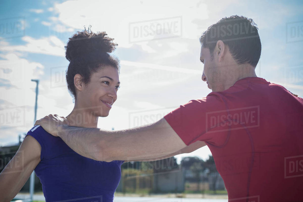 Man instructing young woman training at sport facility - Royalty-free ...