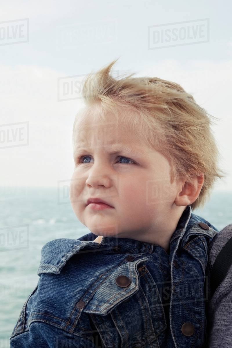 Close up of boy's serious face - Royalty-free Stock Photo | Dissolve