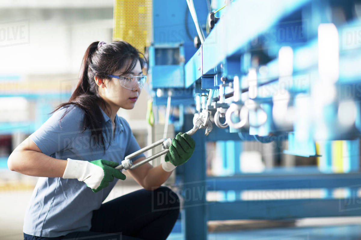 Technician operating machine in factory - Royalty-free Stock Photo ...