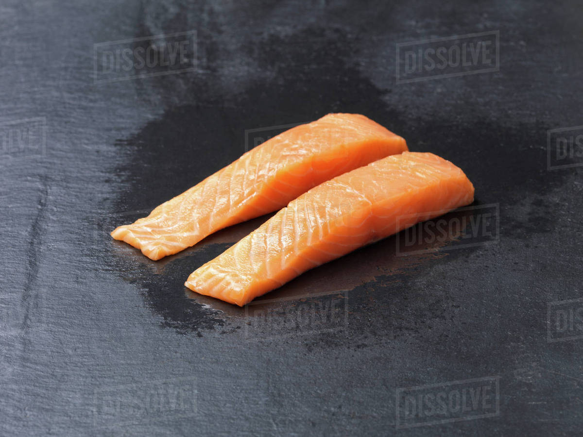 Food, raw fish, two line caught natural salmon fillets on slate - Stock ...