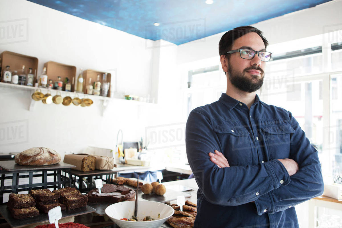 Portrait of mid adult male cafe owner at kitchen counter - Stock Photo ...