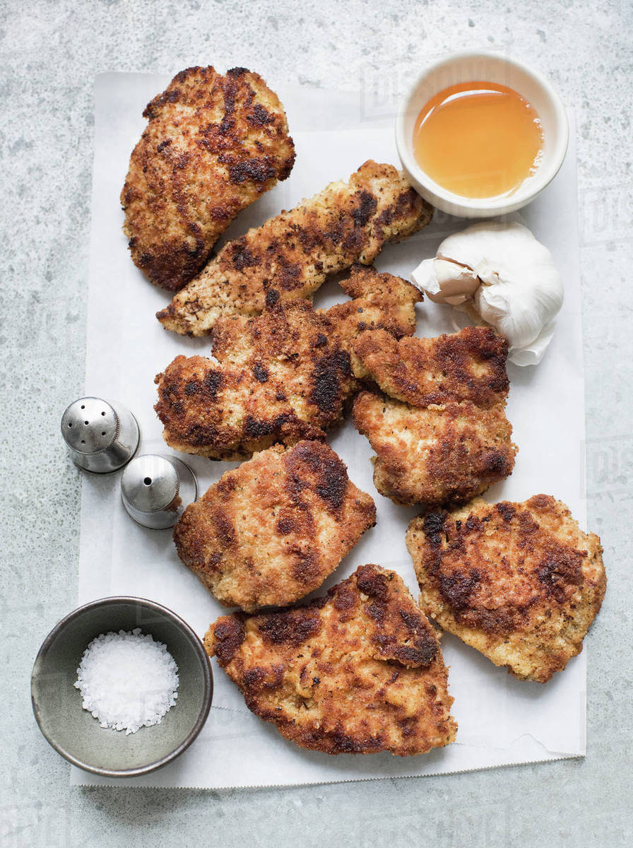 Overhead view of fried breaded meat with dipping sauce - Royalty-free ...