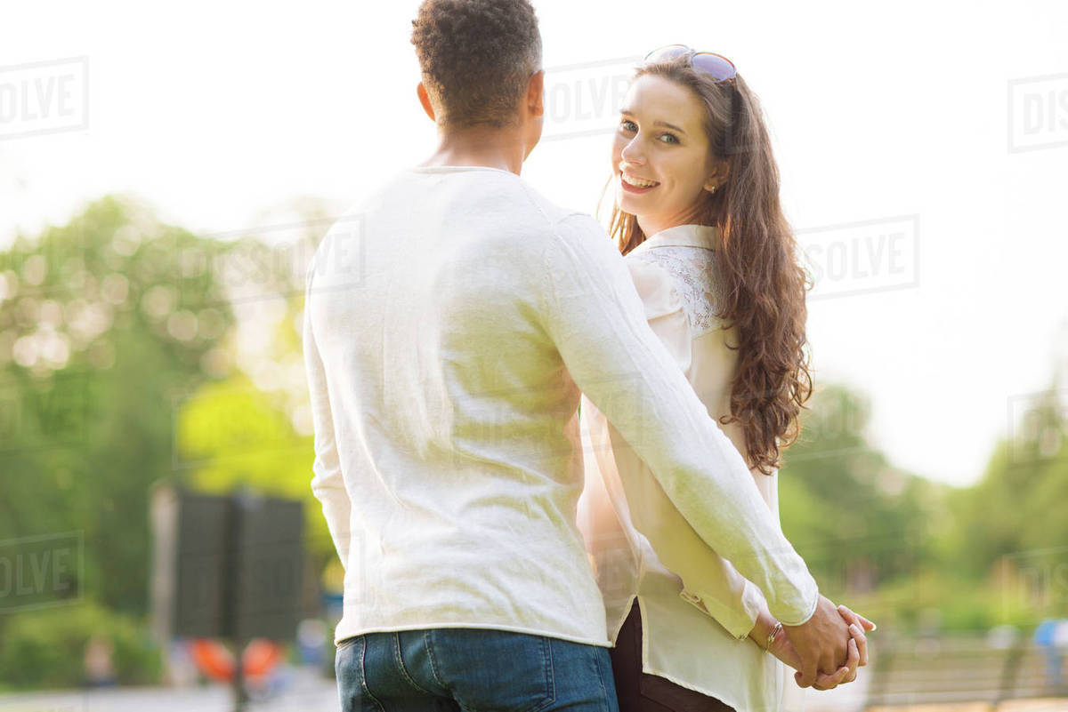 Rear view of couple with arms around each - Royalty-free Stock Photo ...