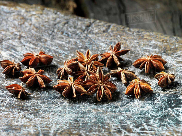 Star anise on rustic wooden board - Royalty-free Stock Photo | Dissolve