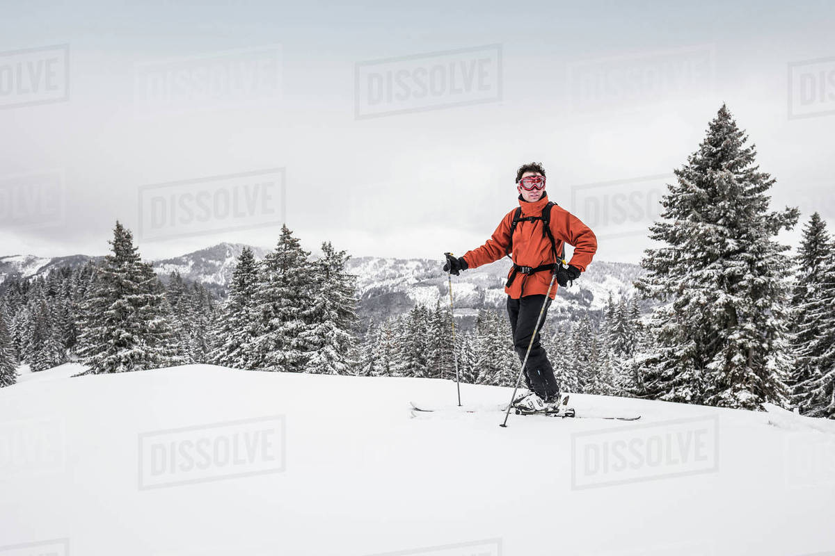 Portrait of male skier on mountain at Kranzegg, Bavaria, Germany ...