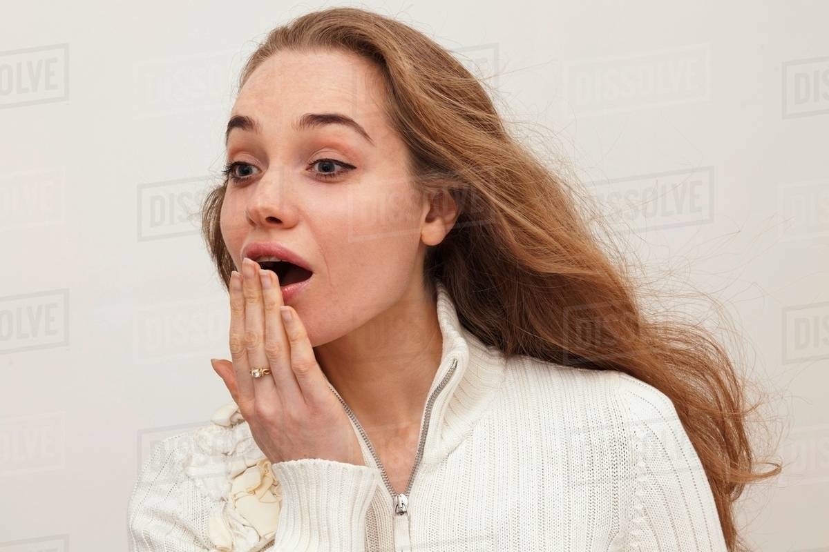 Close up of woman gasping - Royalty-free Stock Photo | Dissolve