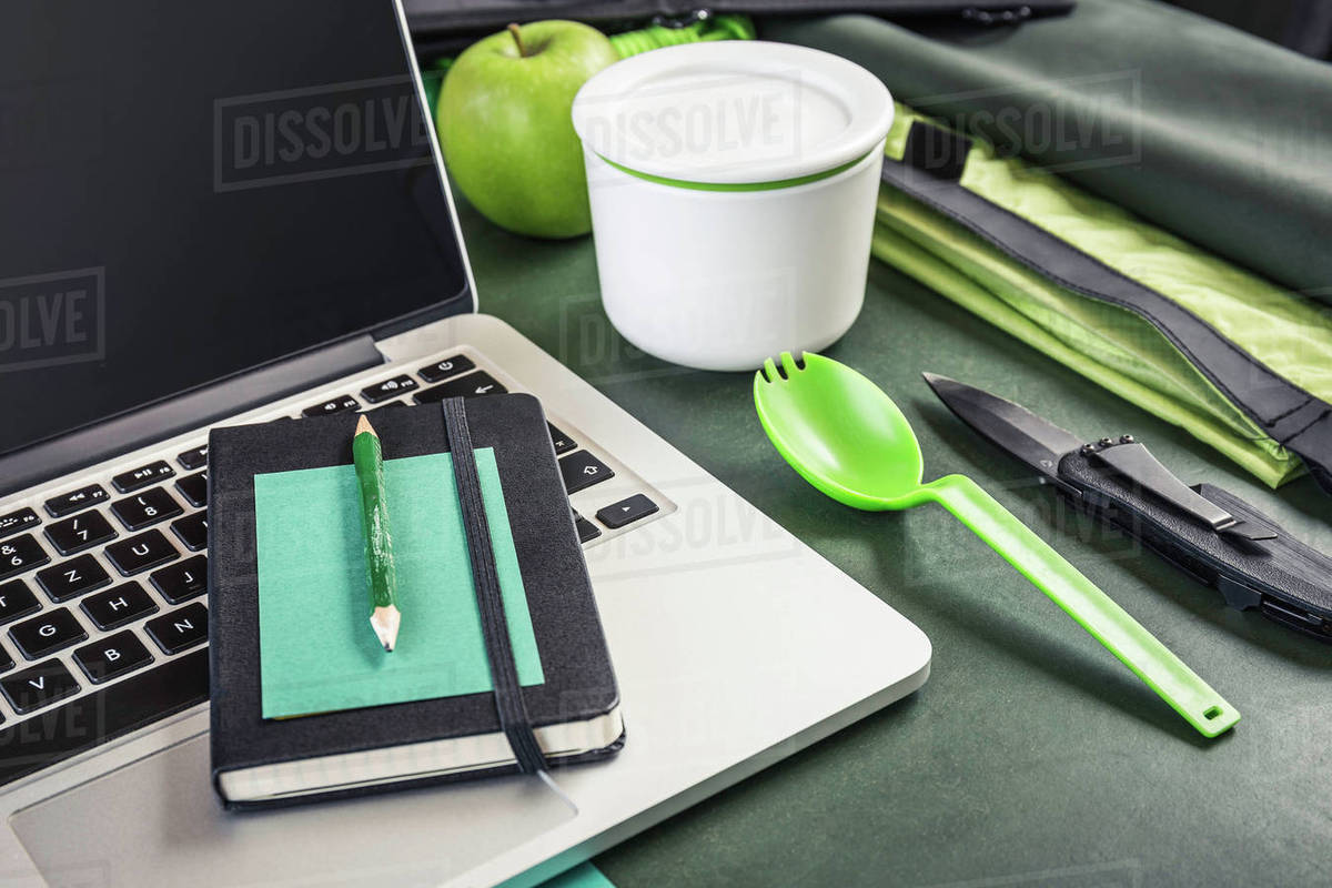Laptop, notebook and pocket knife on table - Royalty-free Stock Photo ...