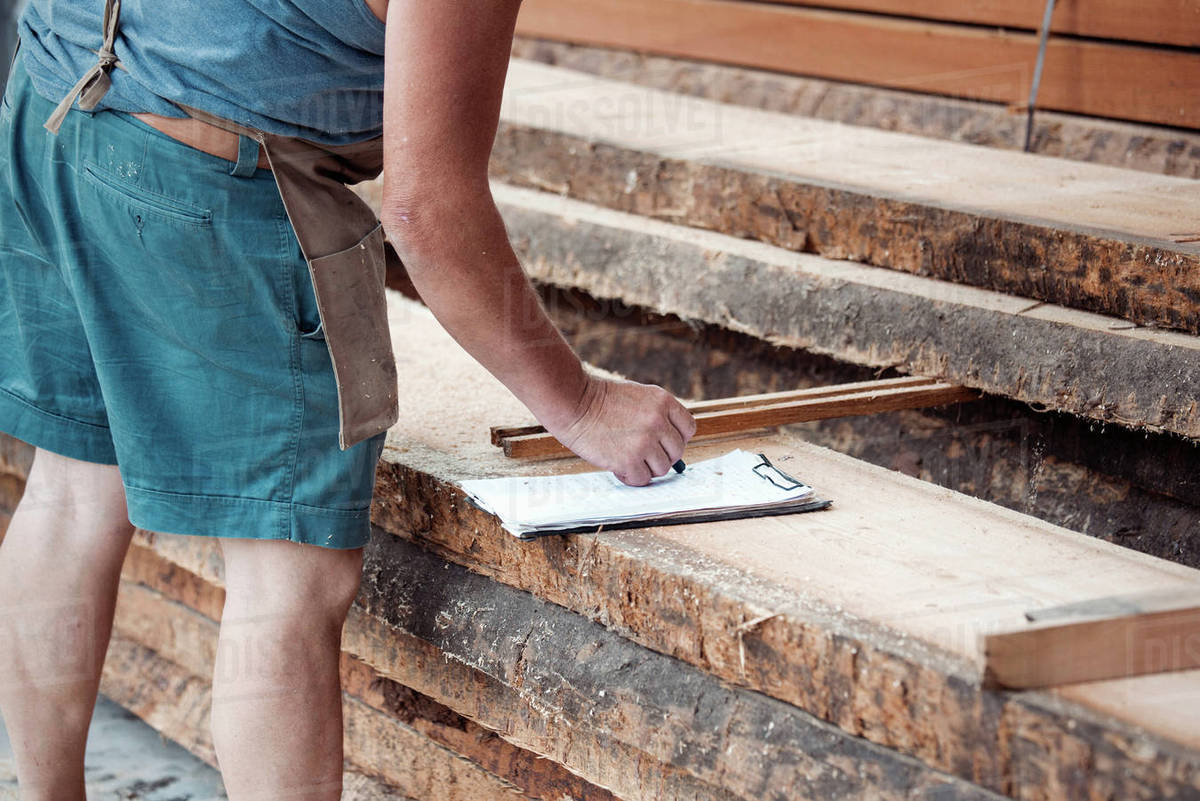 Carpenter working in workshop - Stock Photo - Dissolve