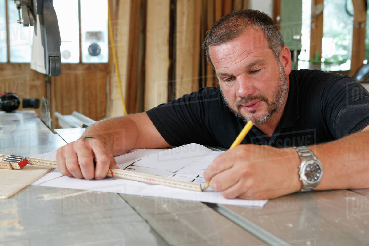 Man drawing blueprint - Royalty-free Stock Photo | Dissolve