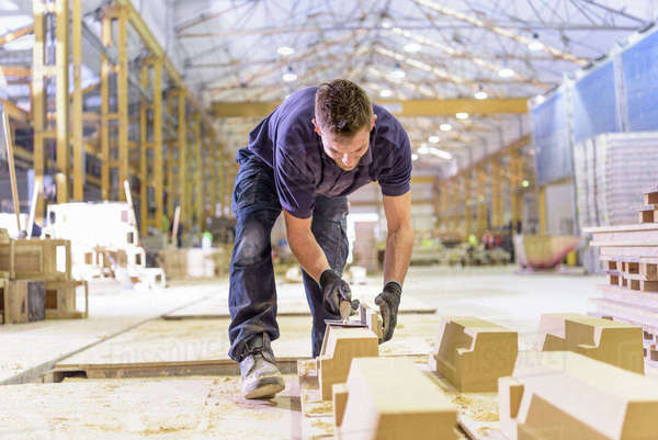 Worker moulding stone in architectural stone factory - Stock Photo ...