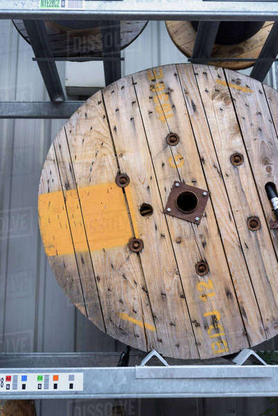 Electrical cable reel at cable storage facility - Stock Photo - Dissolve