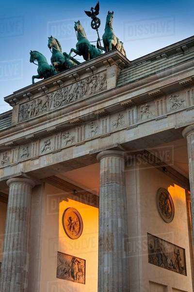 Ornate statues on columned building - Stock Photo - Dissolve