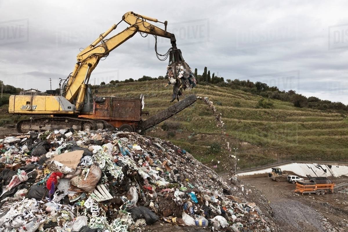 Crane at garbage collection center - Stock Photo - Dissolve