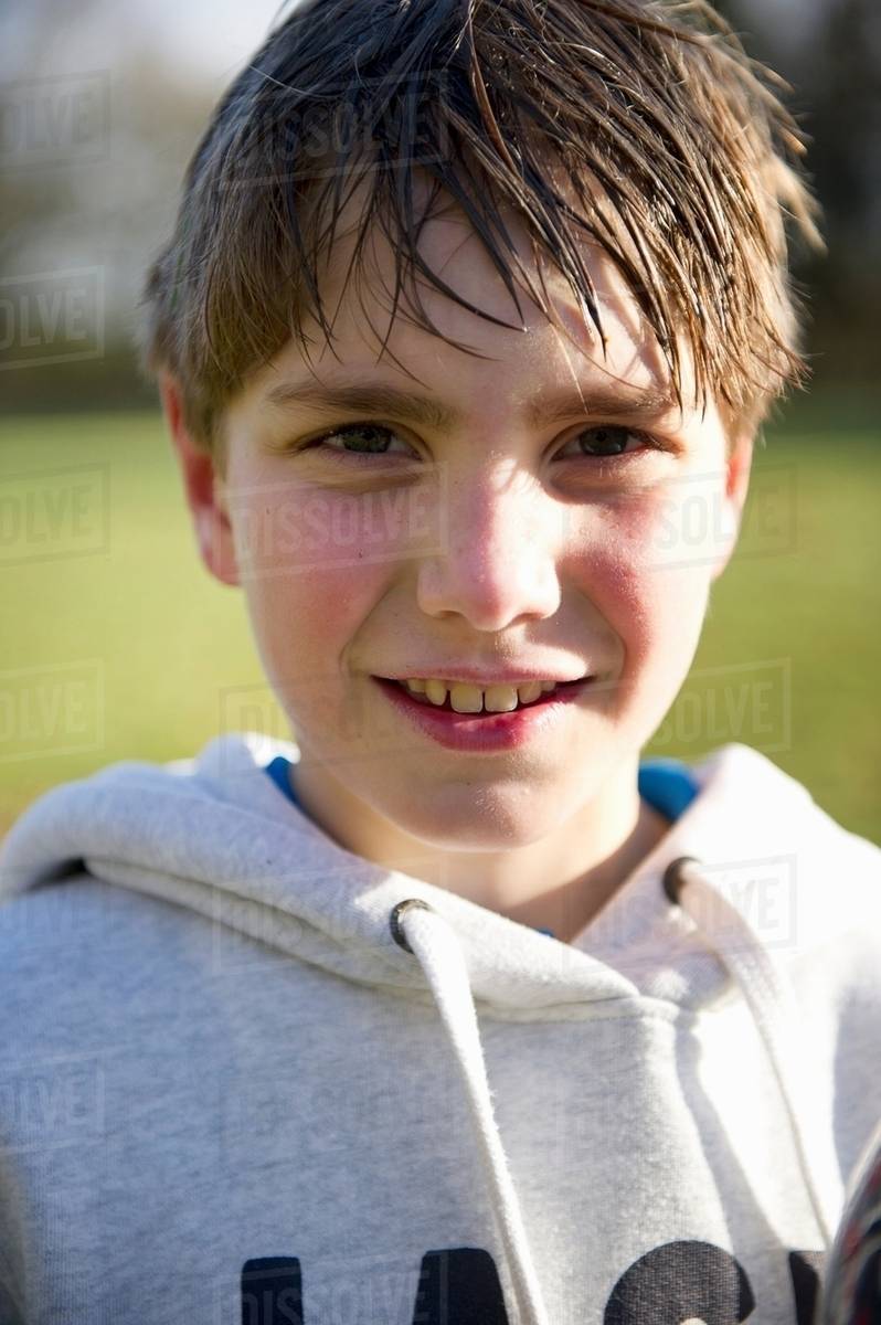 Close up of boys smiling face - Stock Photo - Dissolve