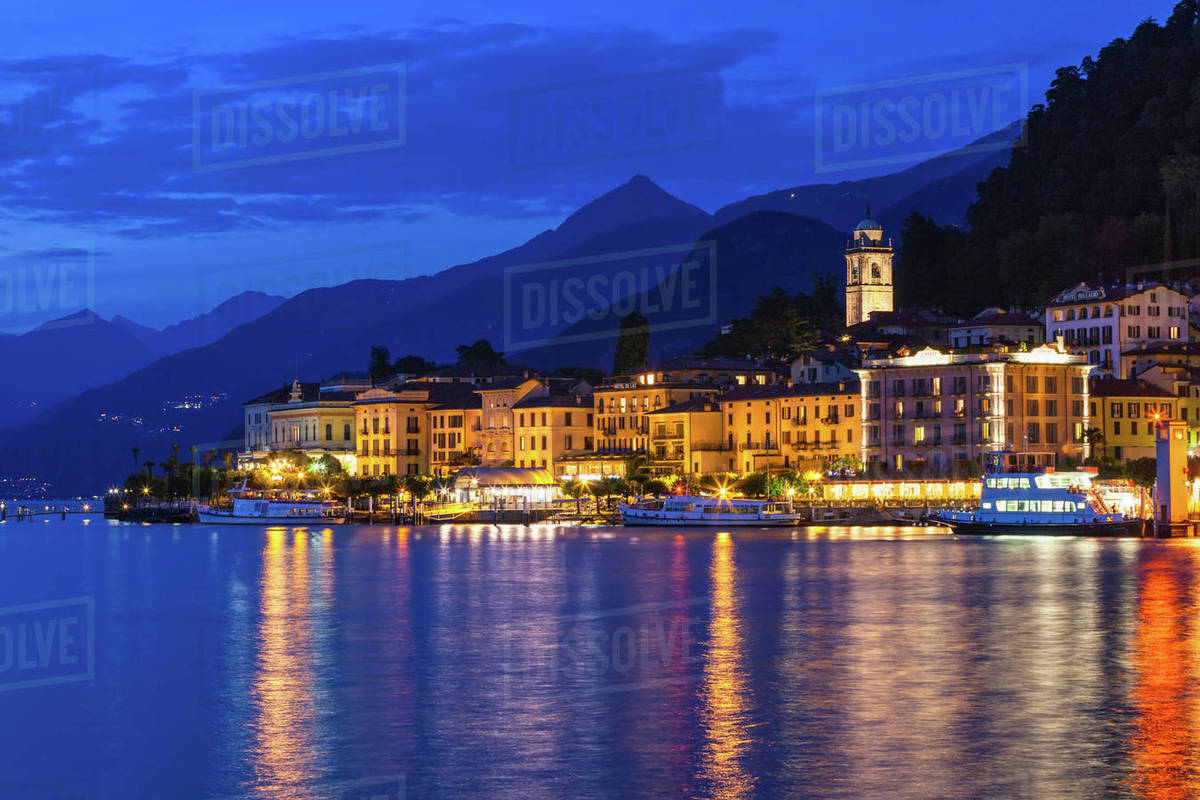 View of waterfront city lights at night, Lake Como, Italy - Royalty ...