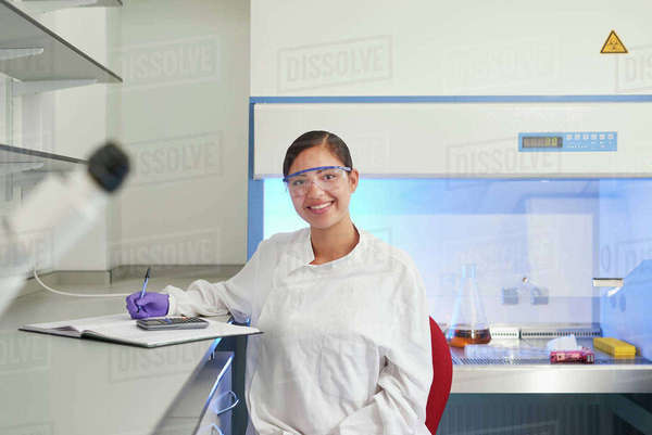 Portrait of scientist in laboratory looking at camera smiling - Royalty ...