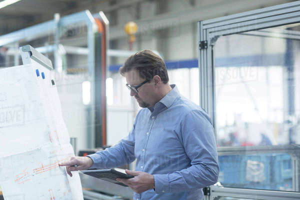 Engineer working in industrial plant - Royalty-free Stock Photo | Dissolve