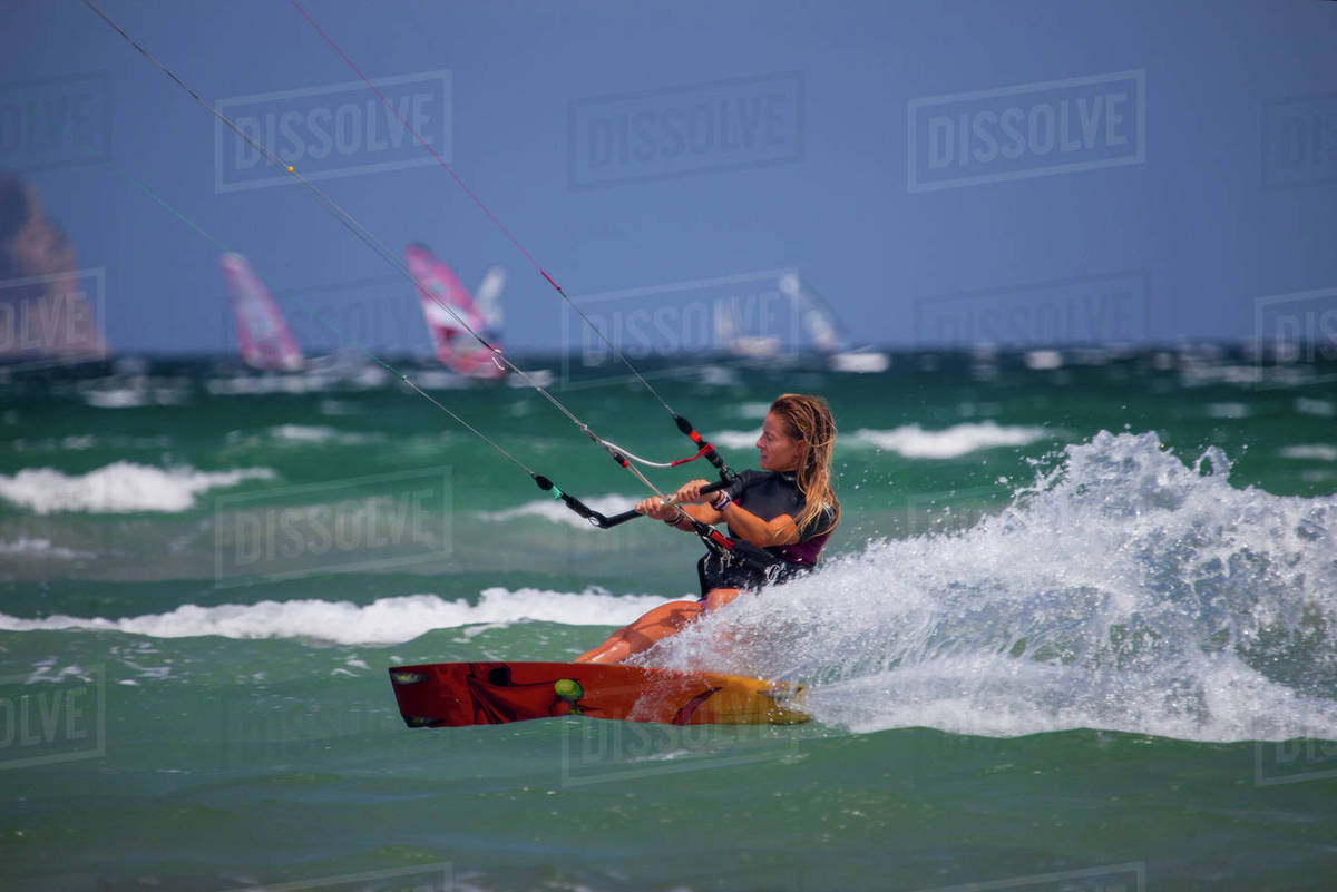 Young woman kite surfing at speed, Majorca, Spain - Royalty-free Stock ...