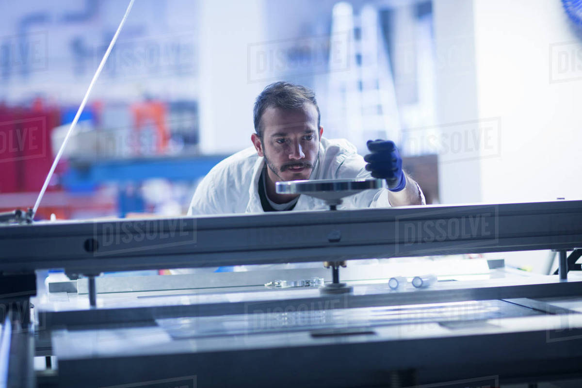Scientist operating heavy machinery - Royalty-free Stock Photo | Dissolve