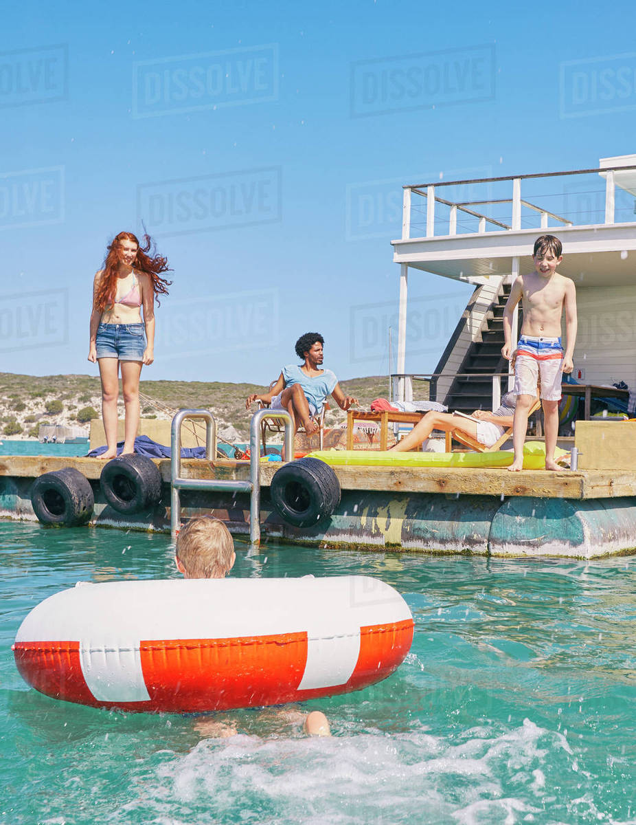 Family having fun on houseboat sun deck, Kraalbaai, South Africa ...