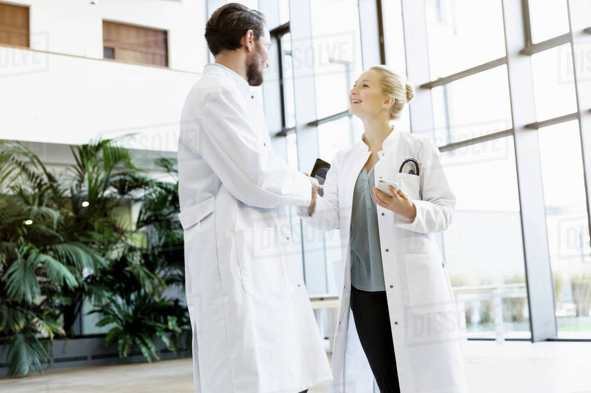 Two doctors having discussion - Stock Photo - Dissolve