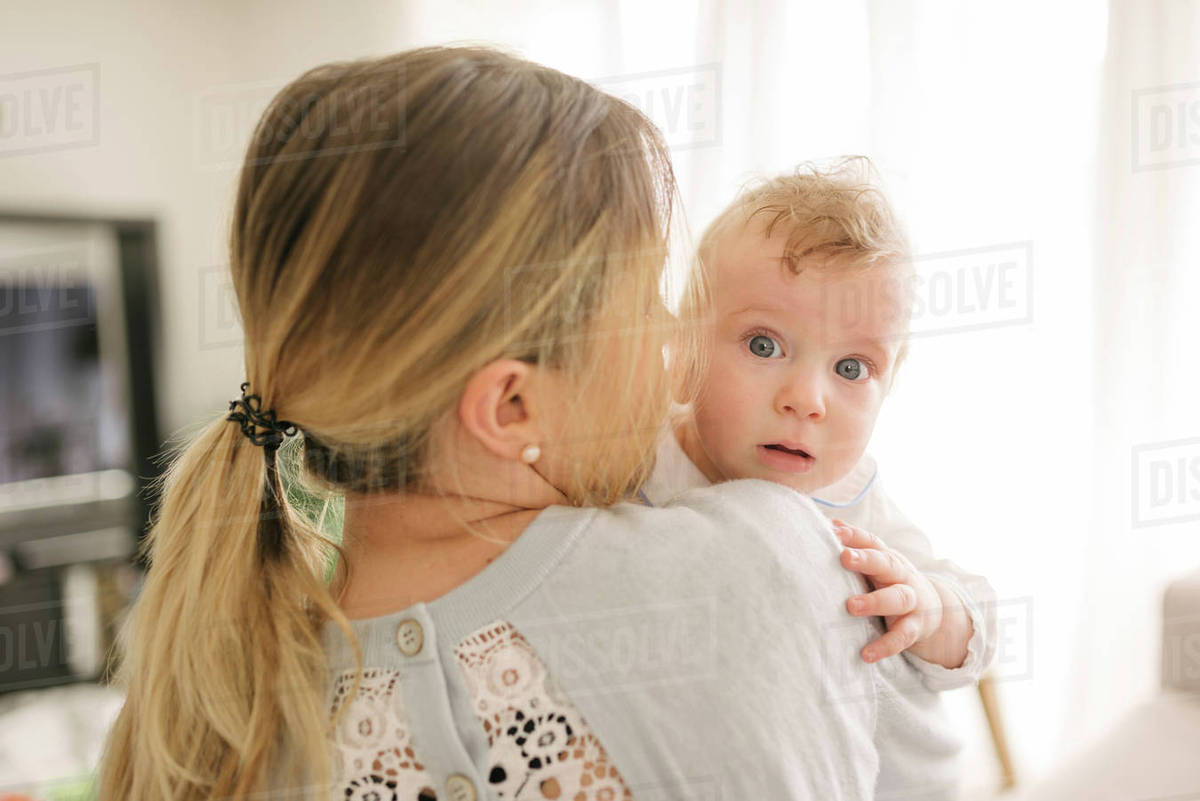 Mother and baby bonding at home - Stock Photo - Dissolve