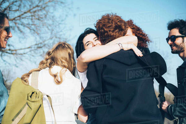 Group of friends hugging, outdoors - Royalty-free Stock Photo | Dissolve