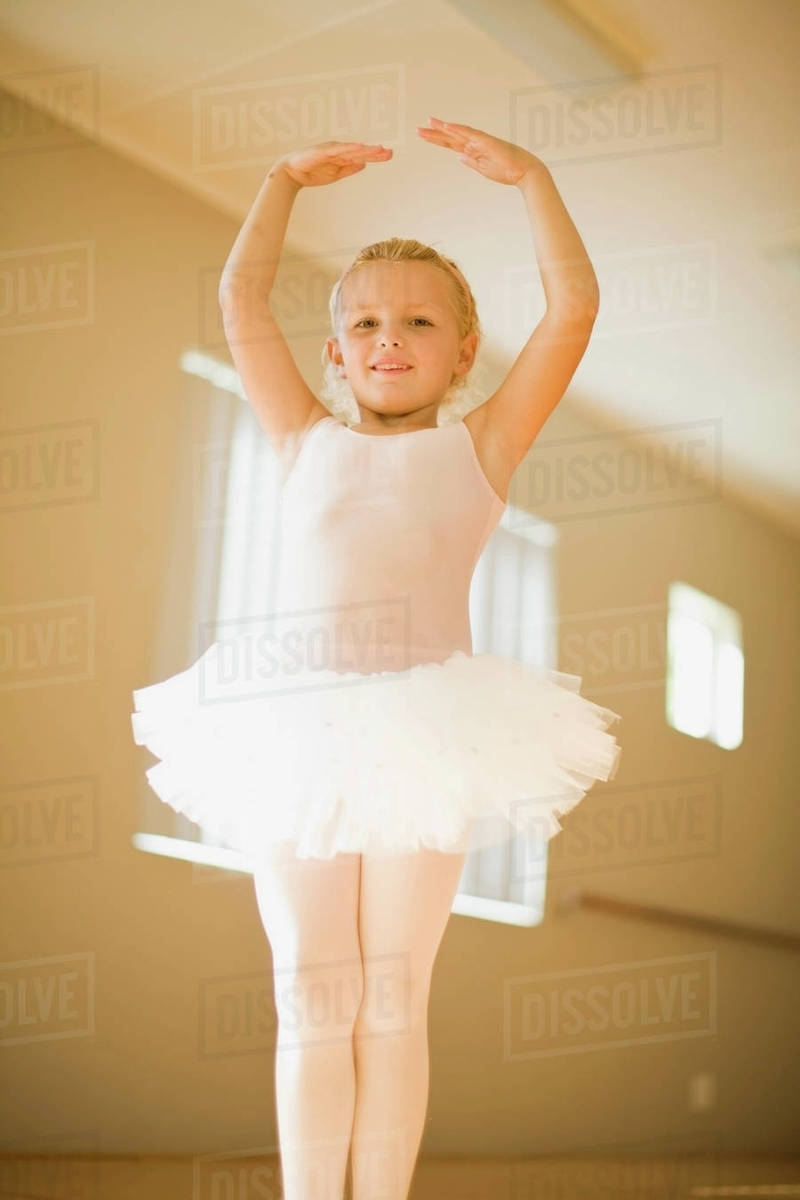 Girl in ballet costume posing - Stock Photo - Dissolve