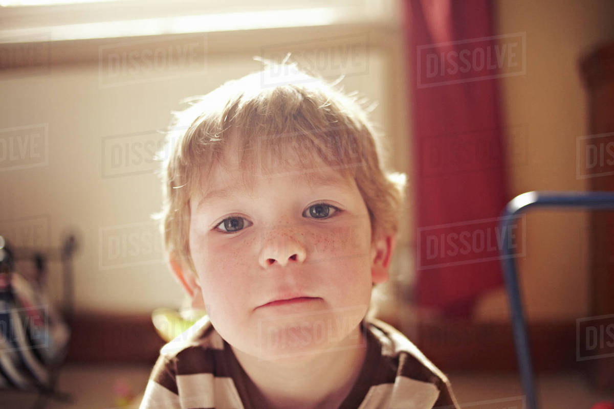 Close up of boy's curious face - Royalty-free Stock Photo | Dissolve