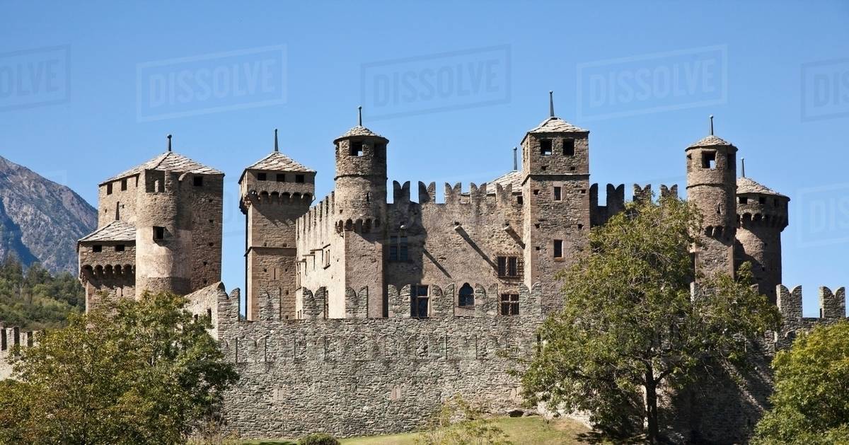 Stone castle in rural landscape - Stock Photo - Dissolve