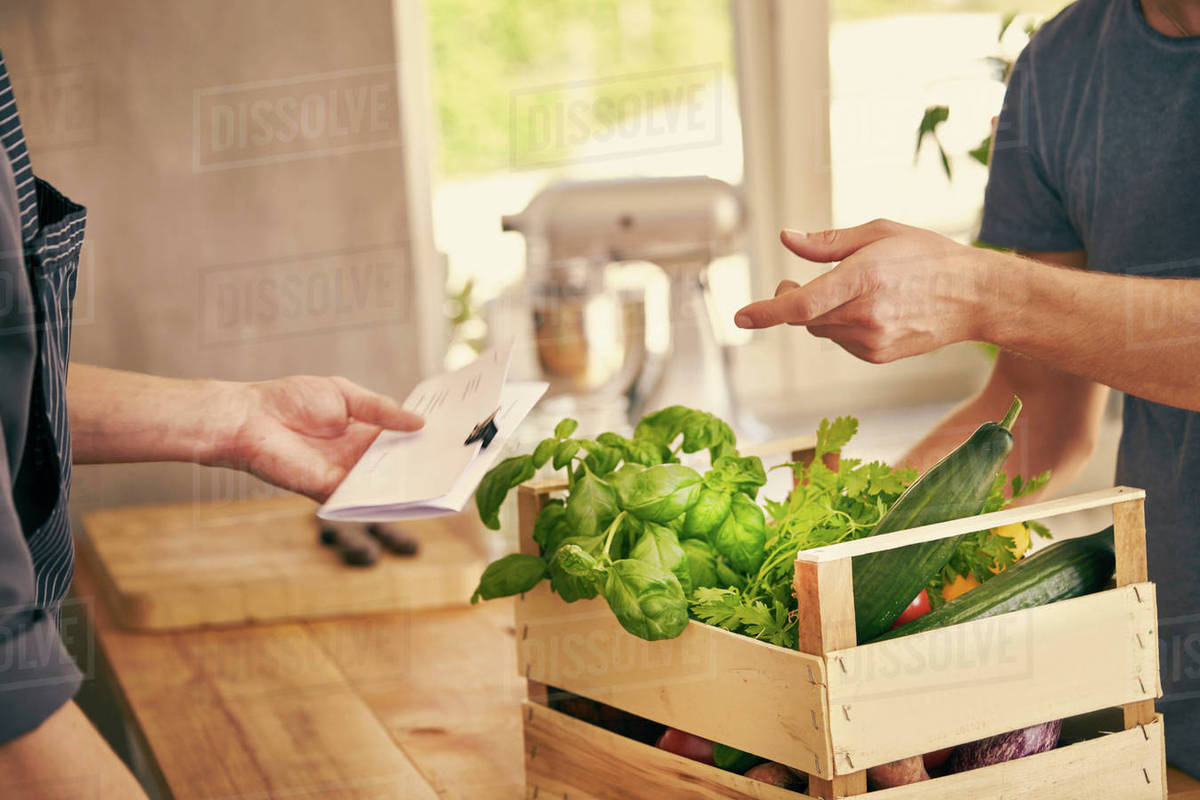 Chef checking delivery note for vegetables - Royalty-free Stock Photo ...