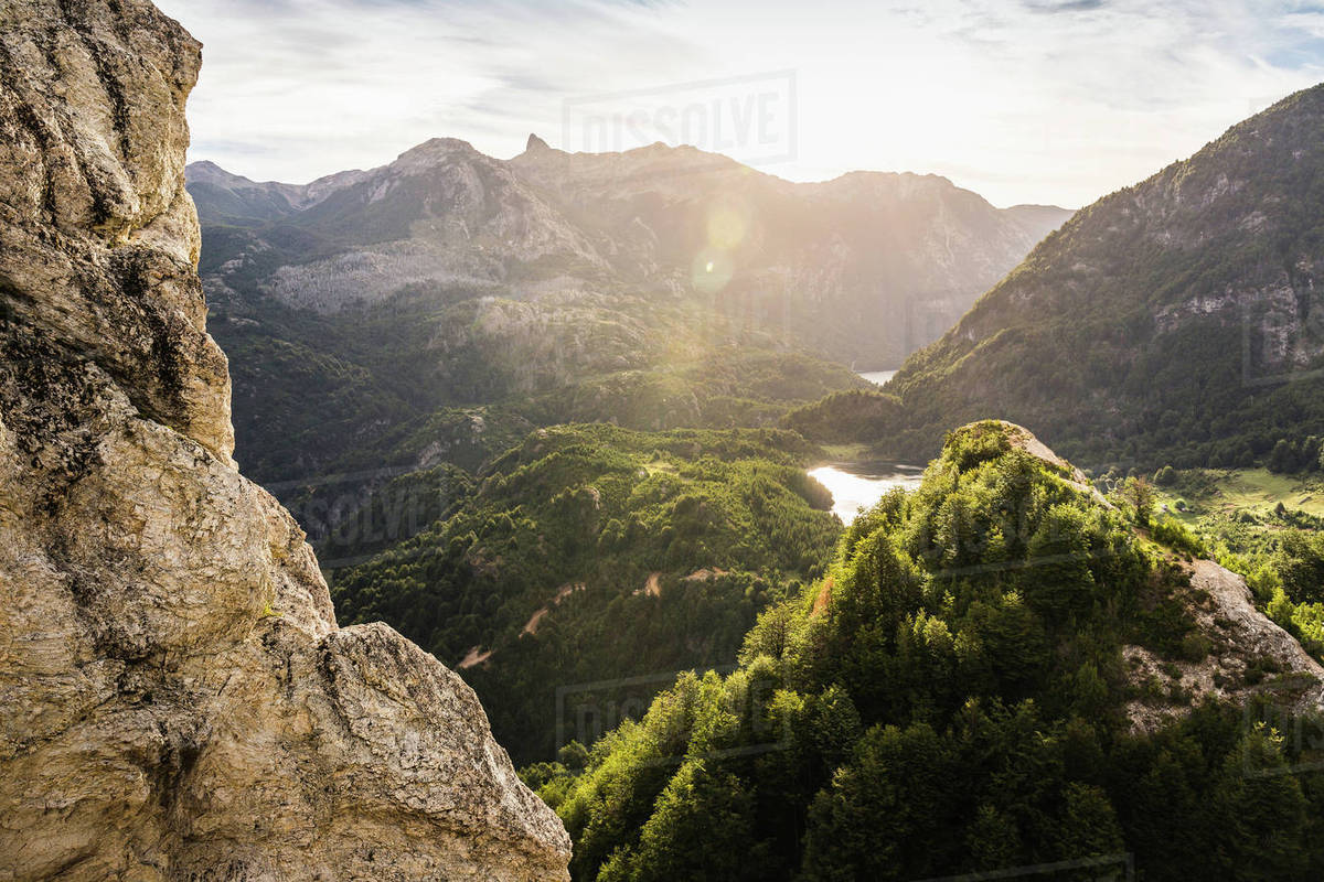 Sunlit mountain valley landscape and rock formations, Futaleufu, Los ...