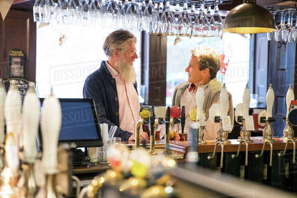 Two mature men, sitting together in pub, talking - Royalty-free Stock ...