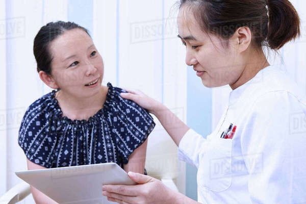 Doctor reassuring patient - Stock Photo - Dissolve